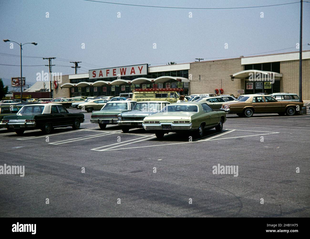Historic vintage cars parked in car park of Safeway supermarket store ...