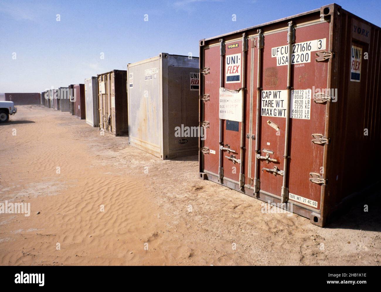 Shipping containers of equipment in oil exploration drilling camps ...