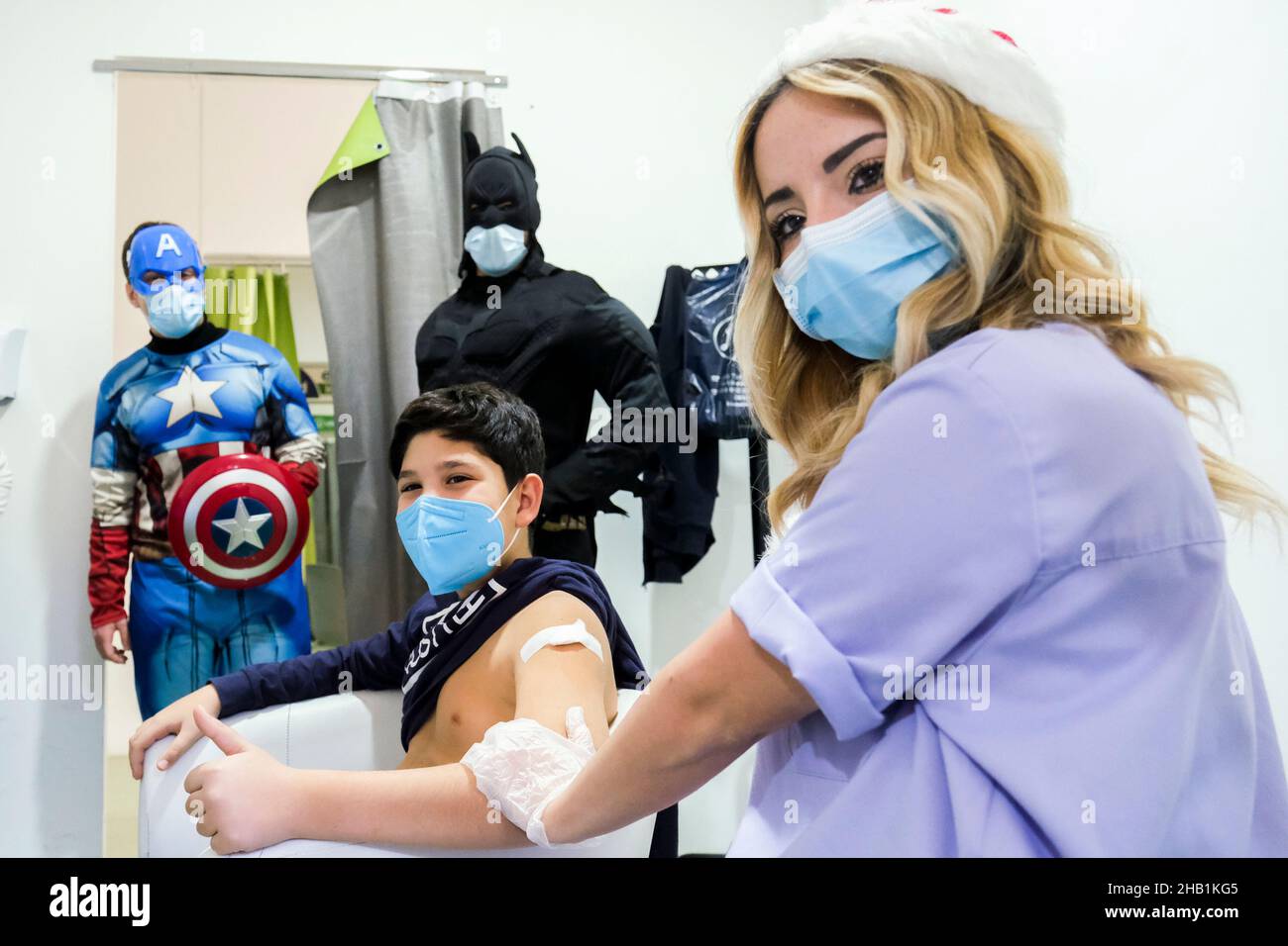 A little boy receives a dose of the paediatric COVID-19 mRNA vaccine ...