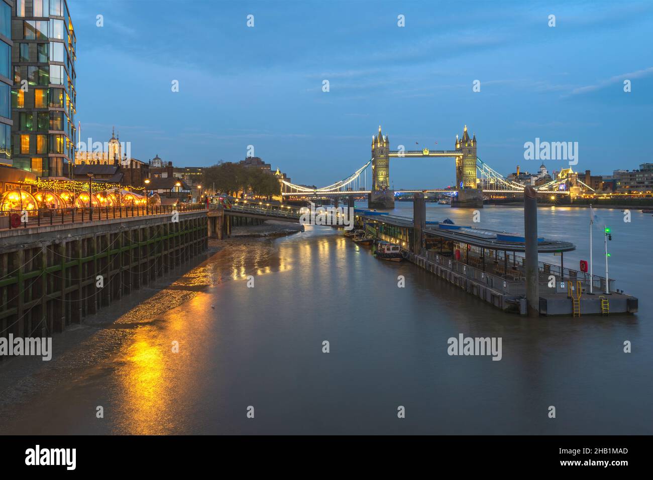 A night time view along the River Thames, from Sugar Quay, of Tower ...