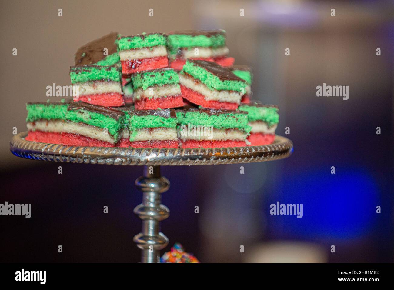 Delicious Italian Rainbow cookies stacked on silver cookie tray at ...