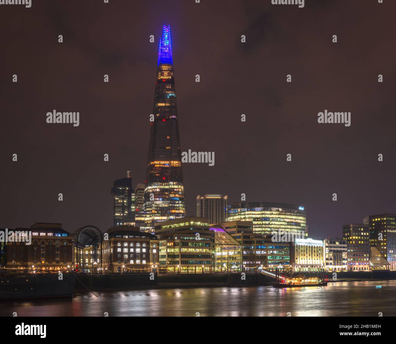 A night time view across the River Thames, from Sugar Quay, of The ...