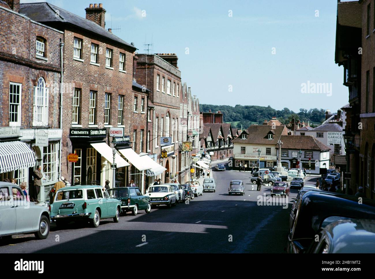 Cars and shops in town centre of Arundel, West Sussex, England.1965 ...