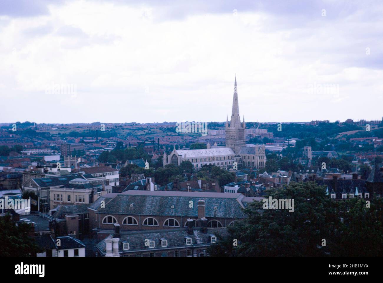 View over city centre buildings with prominent spire of Norwich ...