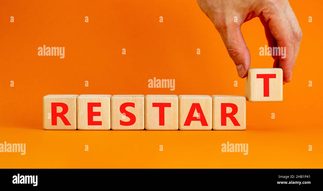 Restart and start symbol. The concept word Restart on wooden cubes ...