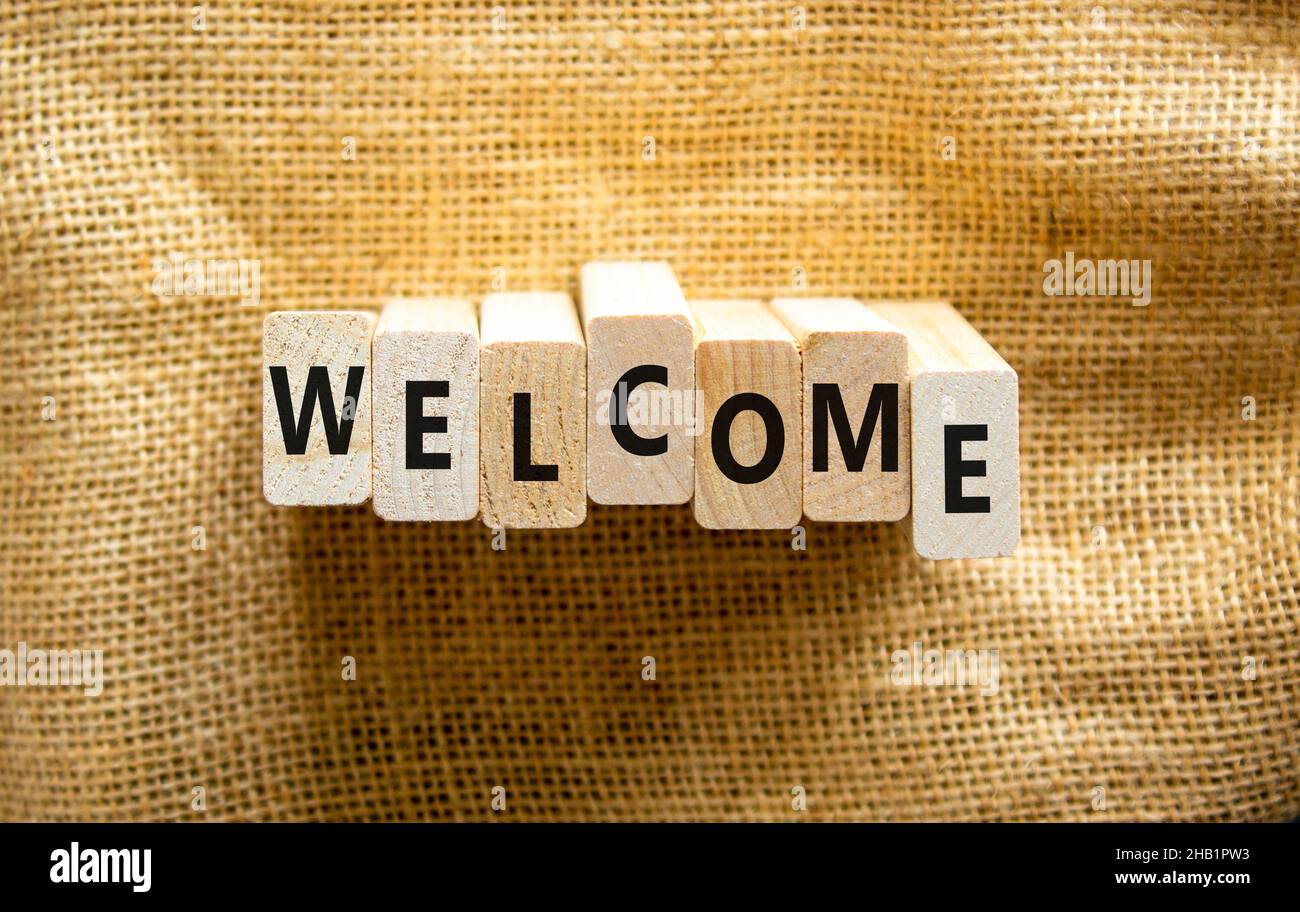 Welcome and support symbol. The concept word Welcome on wooden blocks ...