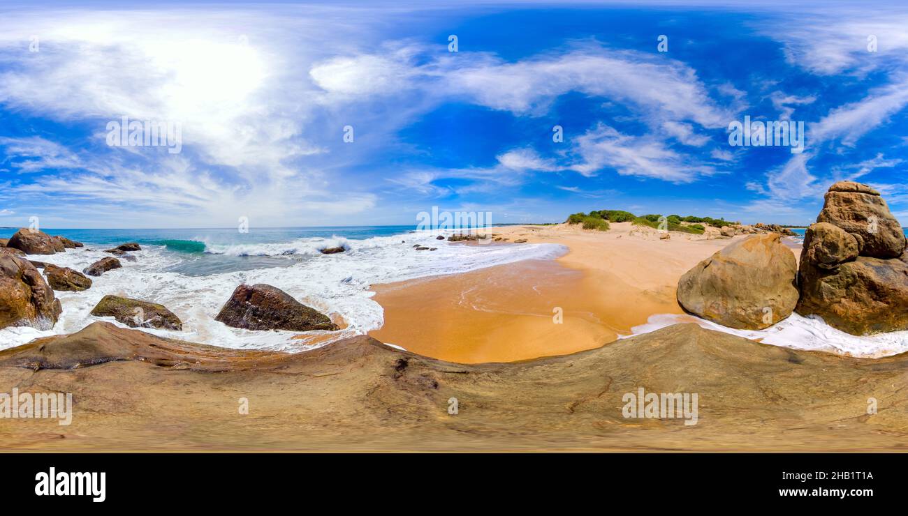 Seascape: Sandy beach and rocks. Wisky point beach, Pottuvil, Sri Lanka ...