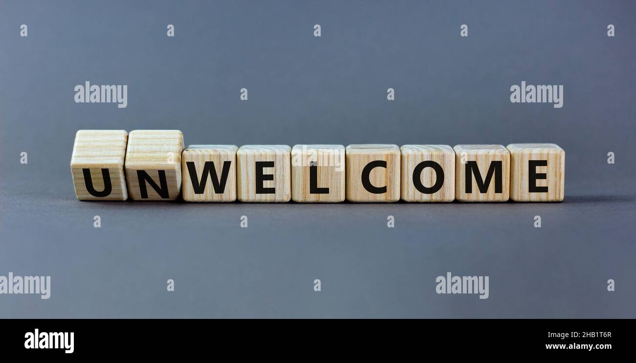 Welcome or unwelcome symbol. Turned wooden cubes and changed the word ...