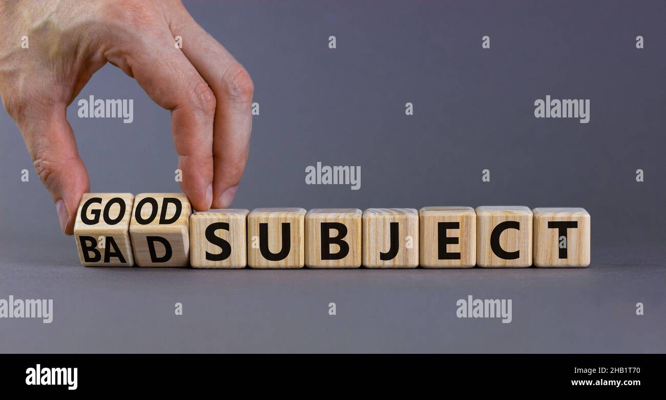 Good or bad subject symbol. Businessman turns wooden cubes and changes ...