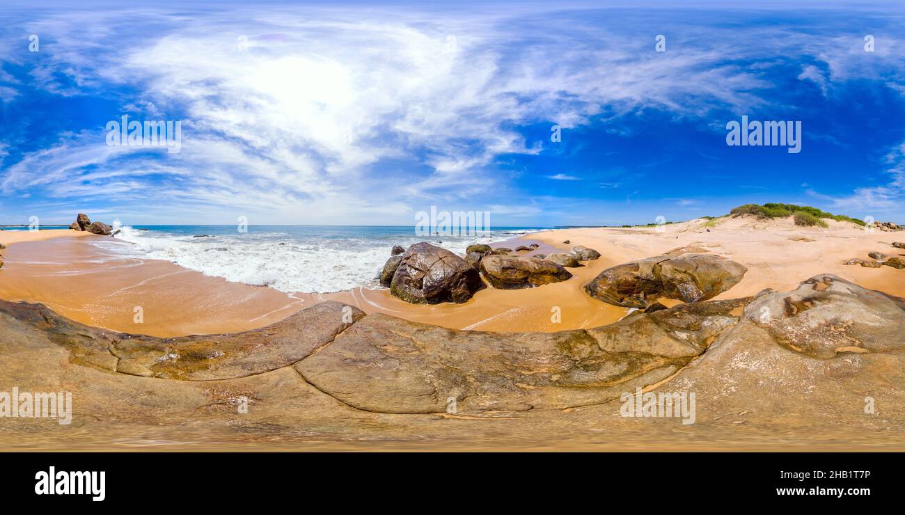 Rocks and surf on a sandy beach. Wisky point beach, Pottuvil, Sri Lanka ...