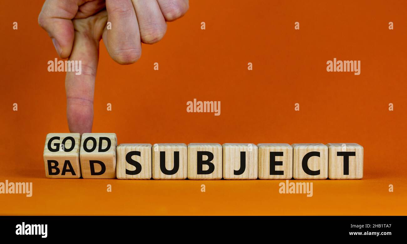 Good or bad subject symbol. Businessman turns wooden cubes and changes ...