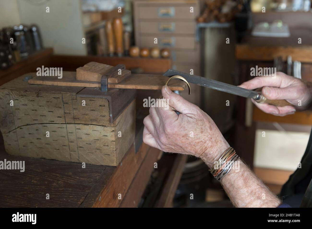 close-up of elderly caucasian hands making jewelry Stock Photo - Alamy