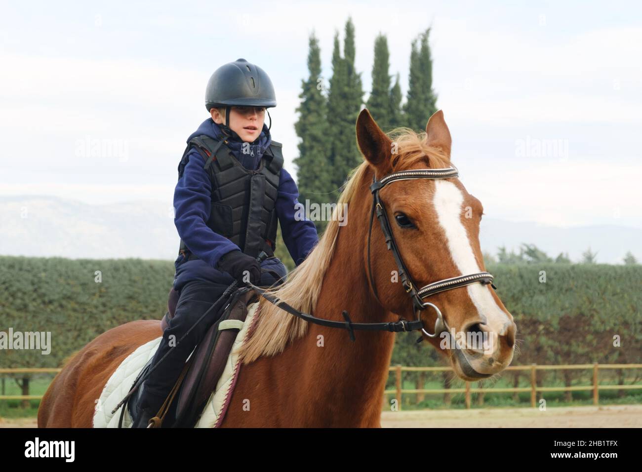 Young boy horse riding atthe ranch Stock Photo - Alamy
