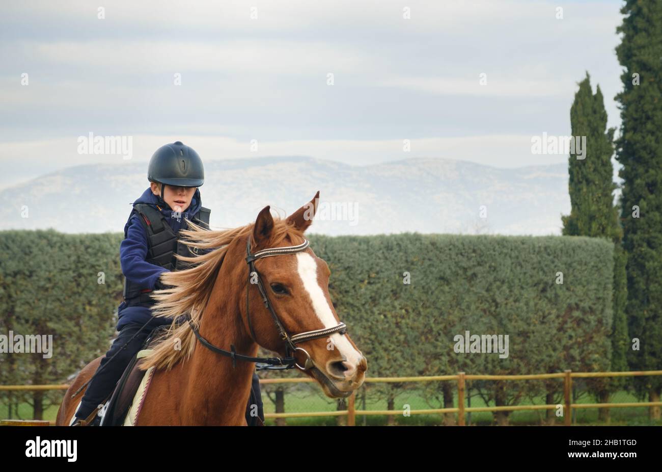 Young boy horse riding atthe ranch Stock Photo - Alamy