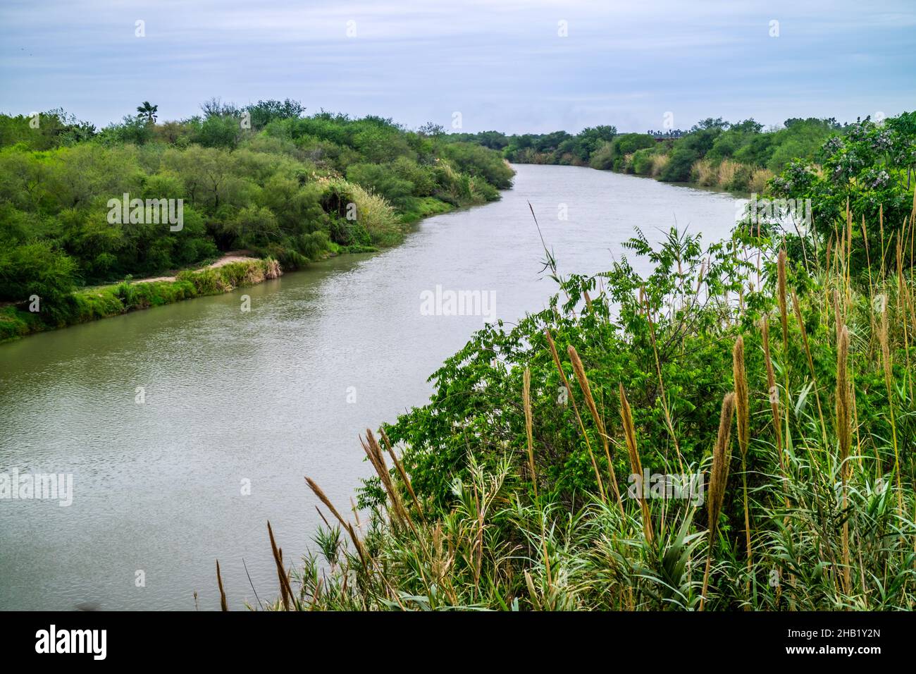 A large flow of water river connecting the Mexico-United States border ...