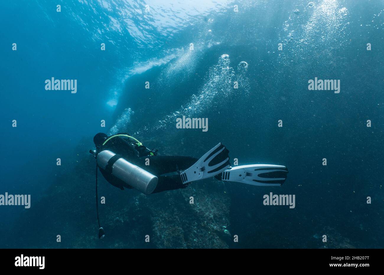 scuba diver fighting strong current around Komodo Island Stock Photo ...