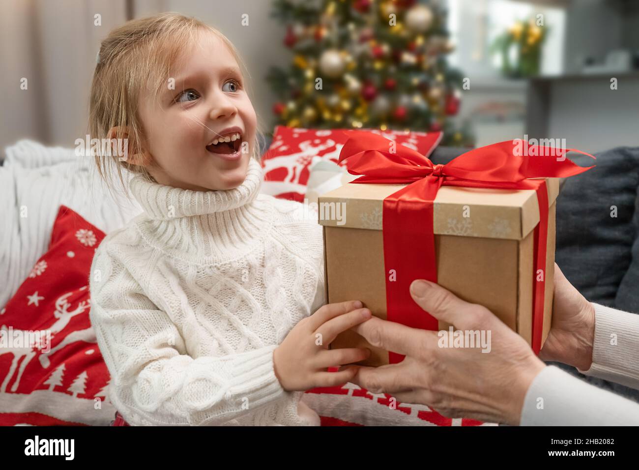 Child receives gift hi-res stock photography and images - Alamy