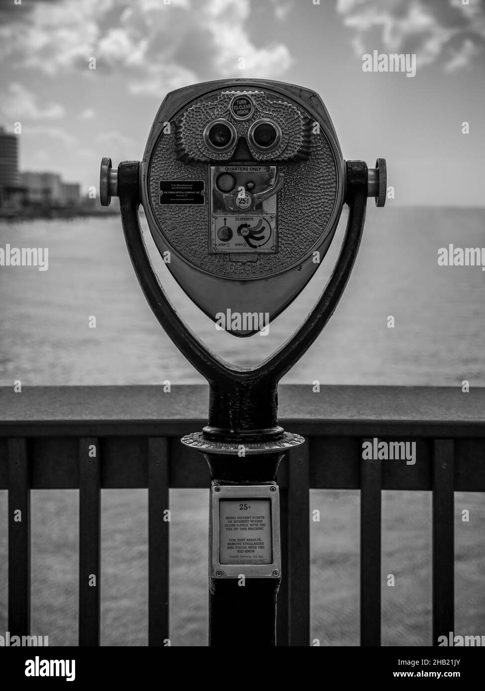 Vertical grayscale shot of a stationary observation tower viewer on a ...