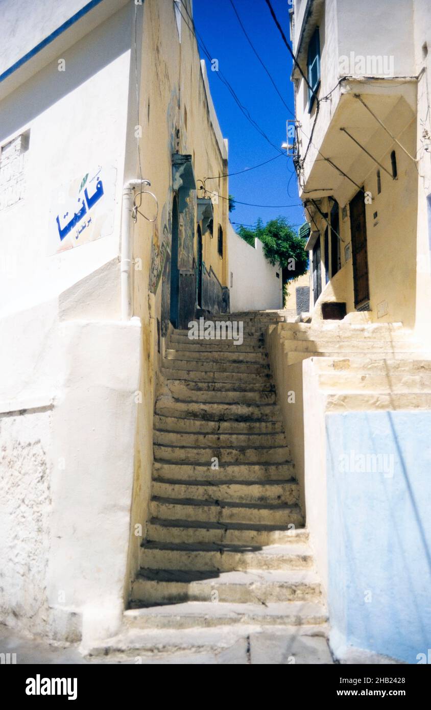 Narrow street stone steps leading to traditional houses in old part of ...