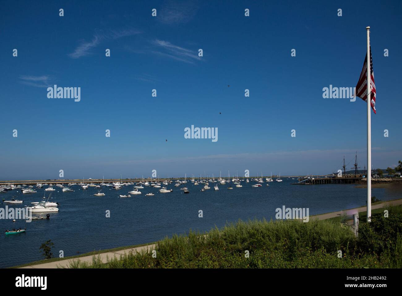 Beach flag boats Stock Photo - Alamy