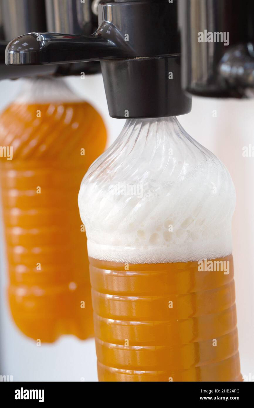 New modern beer taps with plastic bottles on bar counter in pub Stock ...