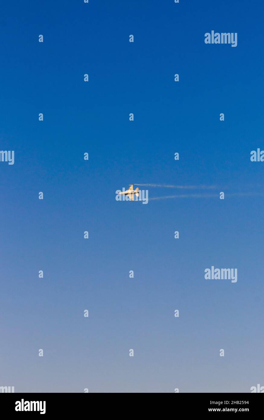 Military airplanes performing stunts in clear blue sky Stock Photo - Alamy
