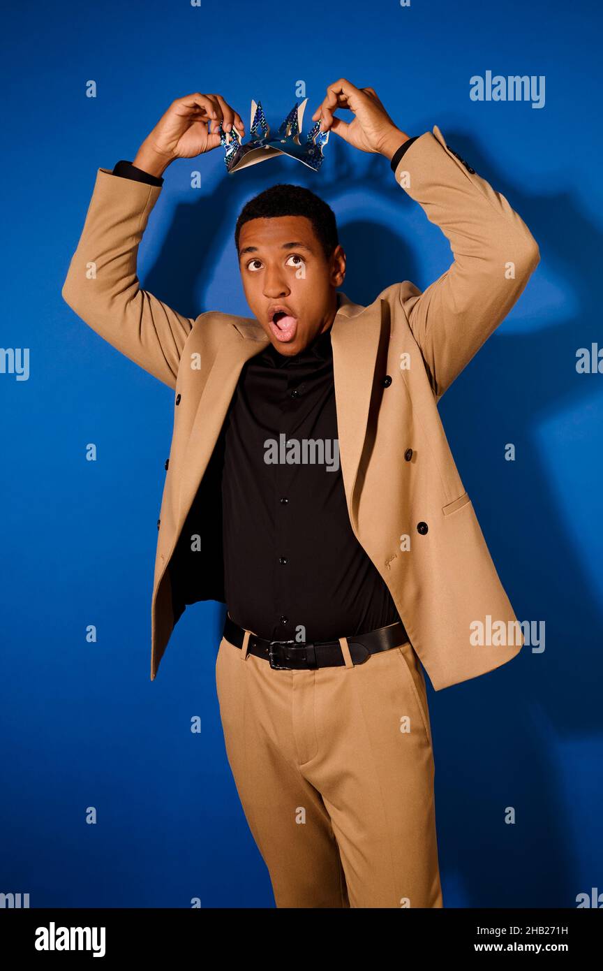 Holding crown hi-res stock photography and images - Alamy