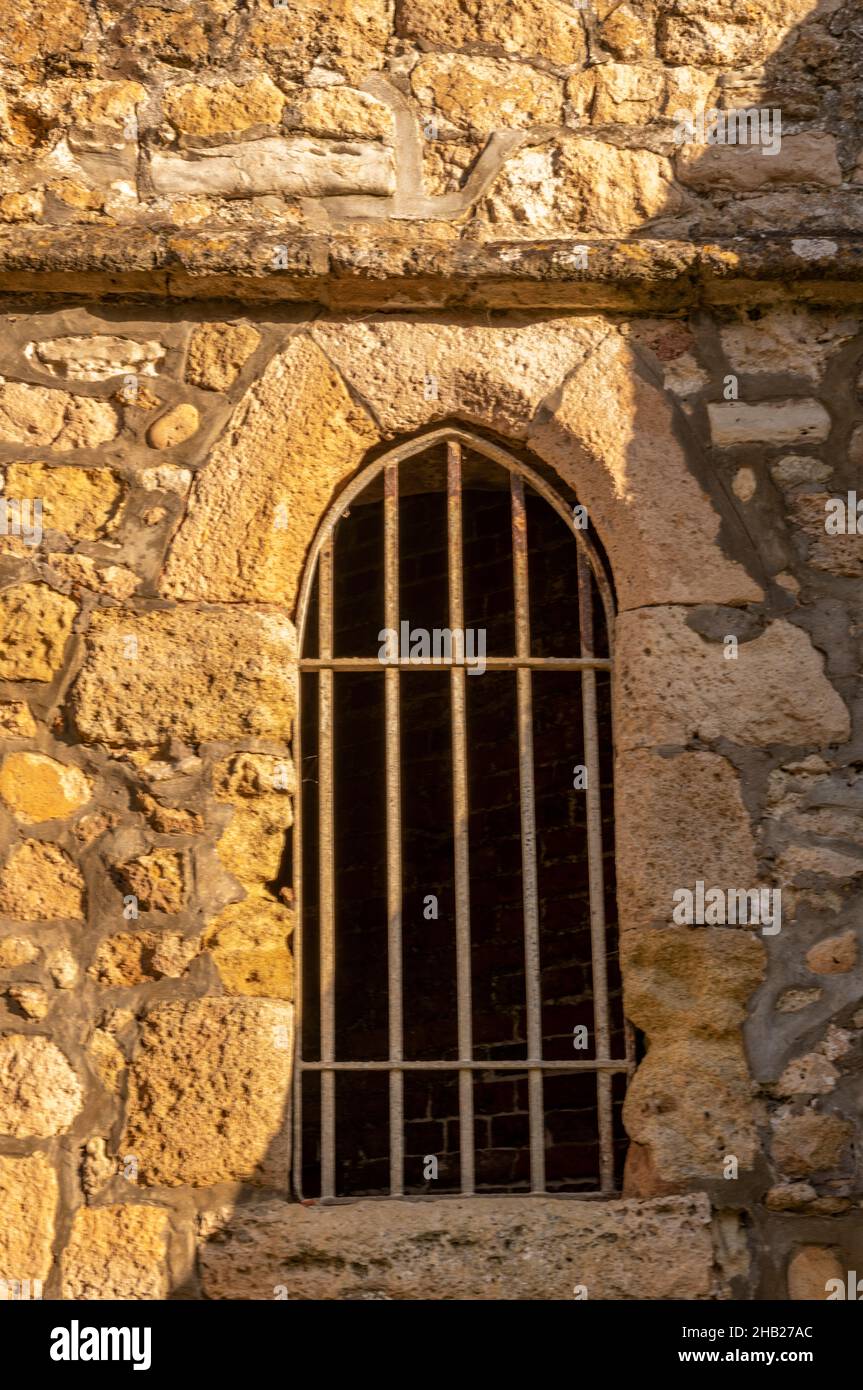 historic gothic arched window in stone wall on old church ...