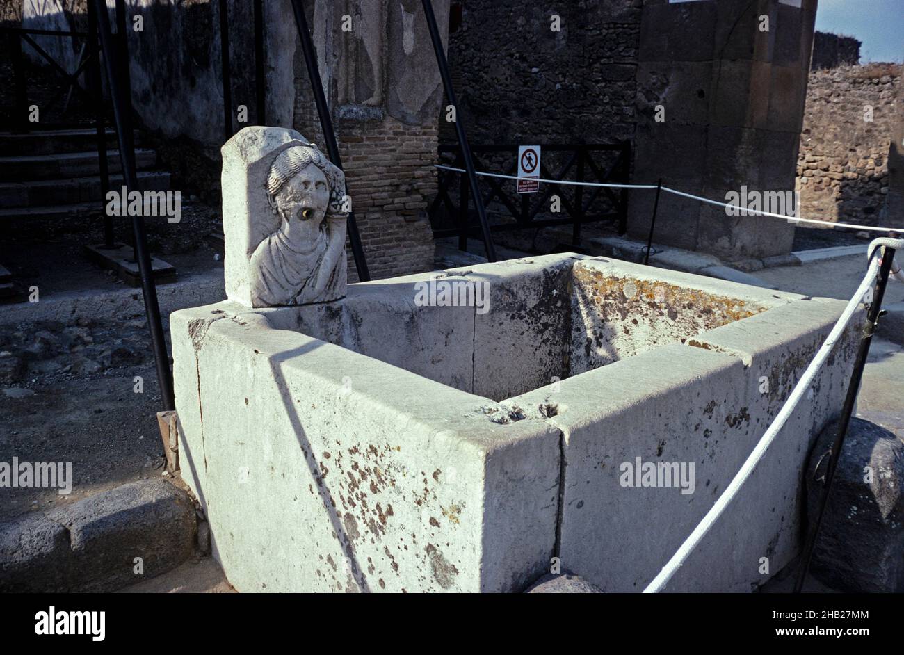 Water fountain trough at the archaeological site of Roman Pompeii ...