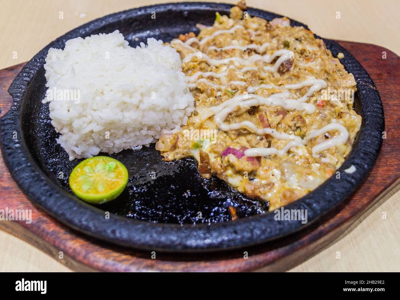 Sizzling sisig, typical meal of Philippines Stock Photo - Alamy