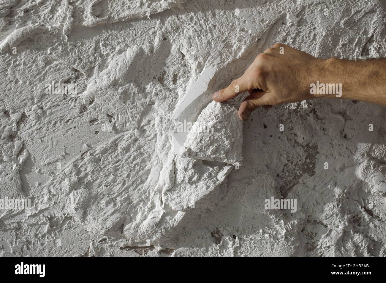 Process of creating white textured clay wall with cracks and ...