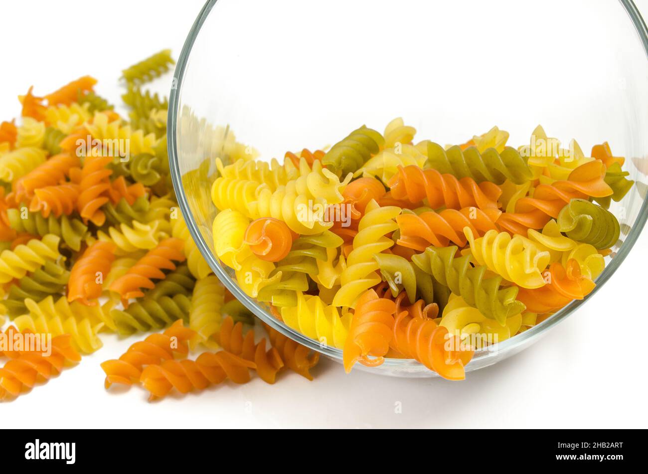 multicolor spiral macaroni isolated on white background Stock Photo - Alamy