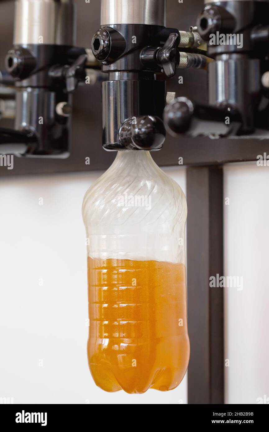 New modern beer taps with plastic bottles on bar counter in pub Stock ...