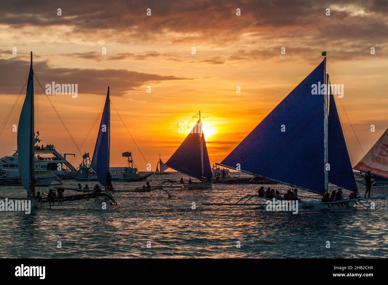 BORACAY, PHILIPPINES - FEBRUARY 1, 2018: Sunset behind Bangkas (paraw ...