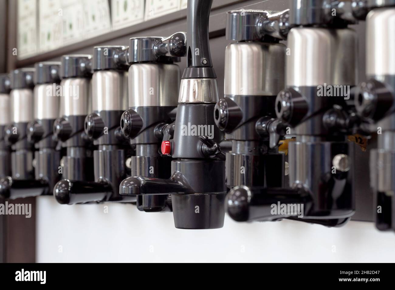Beer taps for draught drinks are built into wooden boards in pub Stock ...