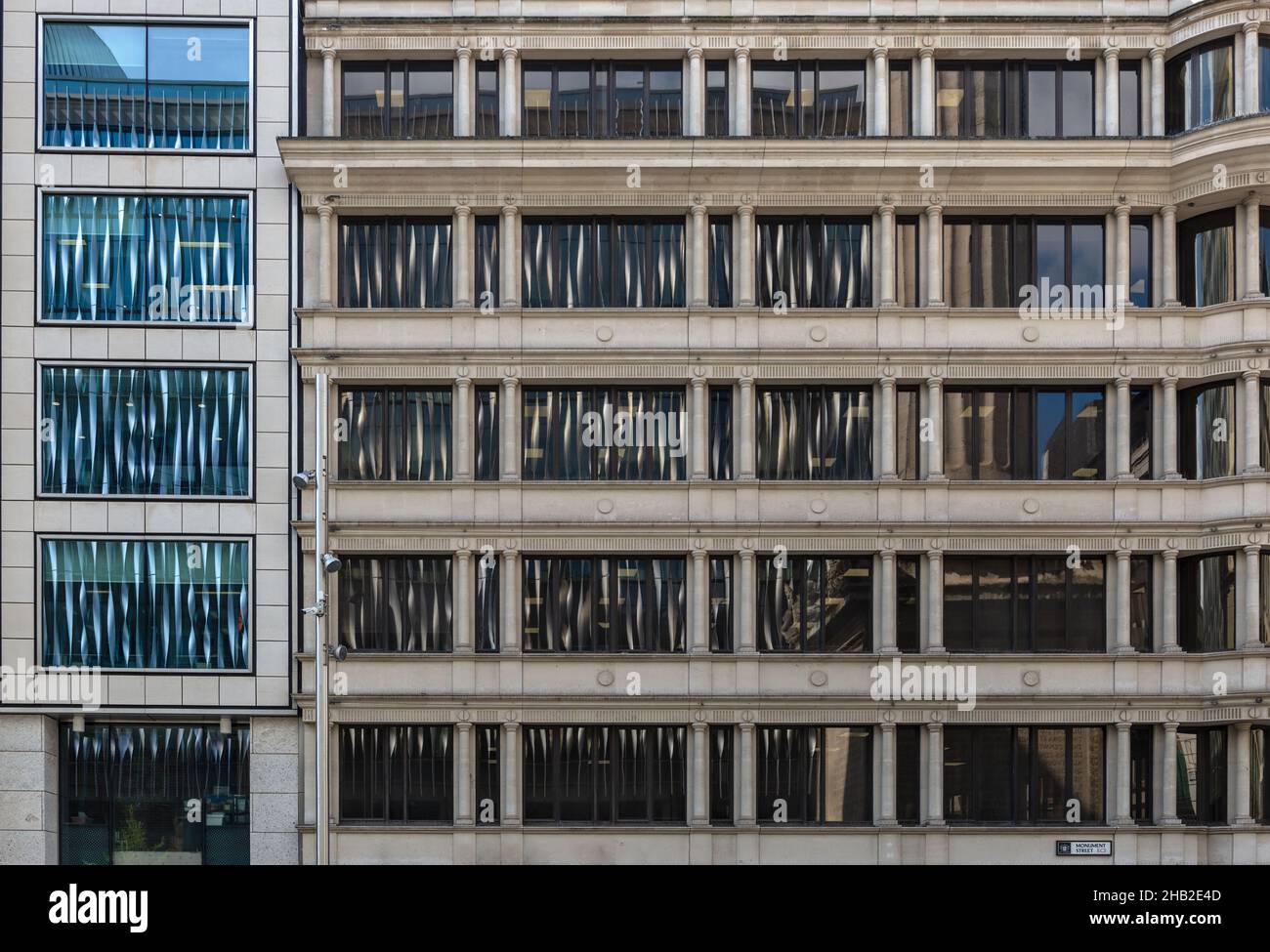 Modern buildings with artistic reflections of neighbouring buildings in ...