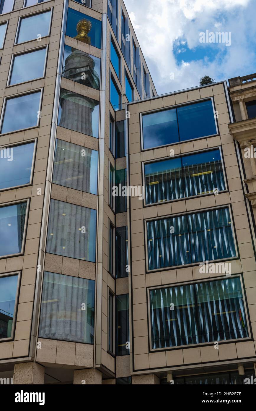 The Great Fire of London Memorial reflecting in the glass of modern ...