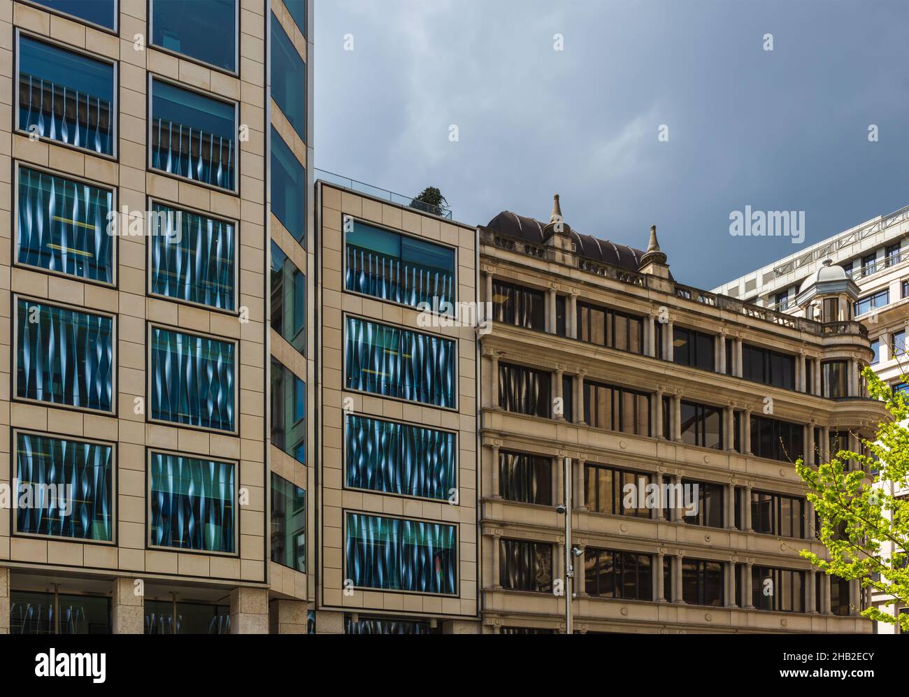 Modern buildings with artistic reflections of neighbouring buildings in ...