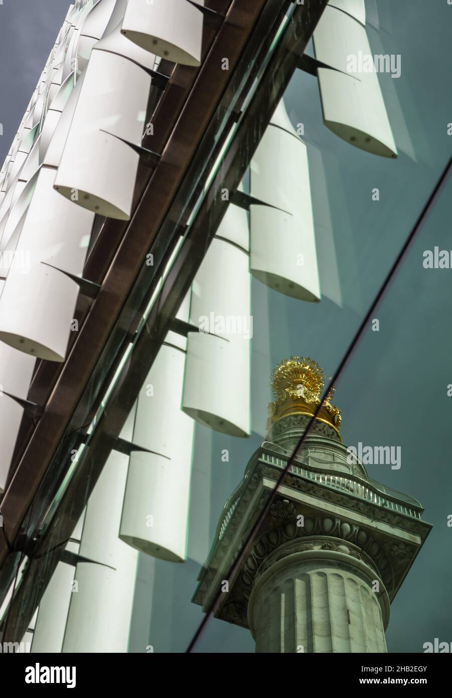 The Great Fire of London Memorial reflecting in the glass of modern ...