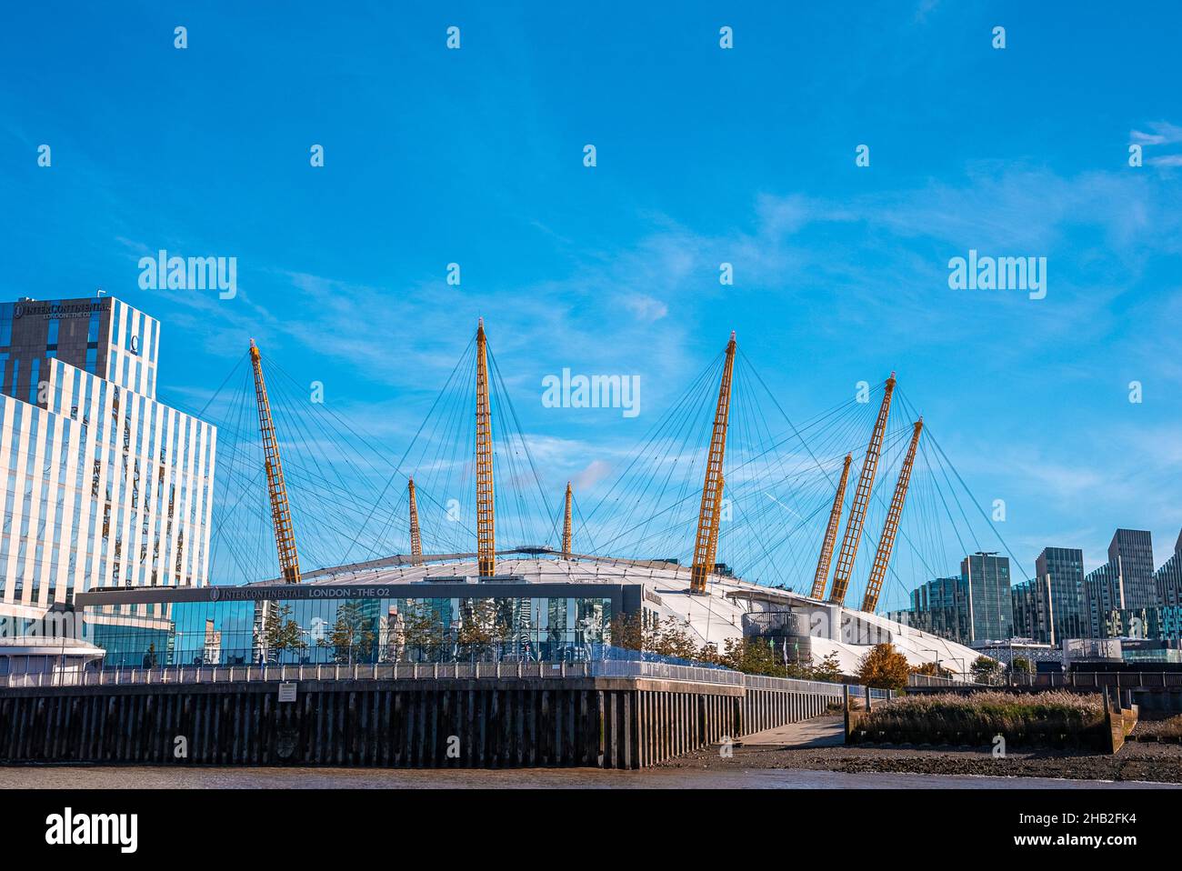 View from the river Thames over Millennium dome or O2 Arena in London ...