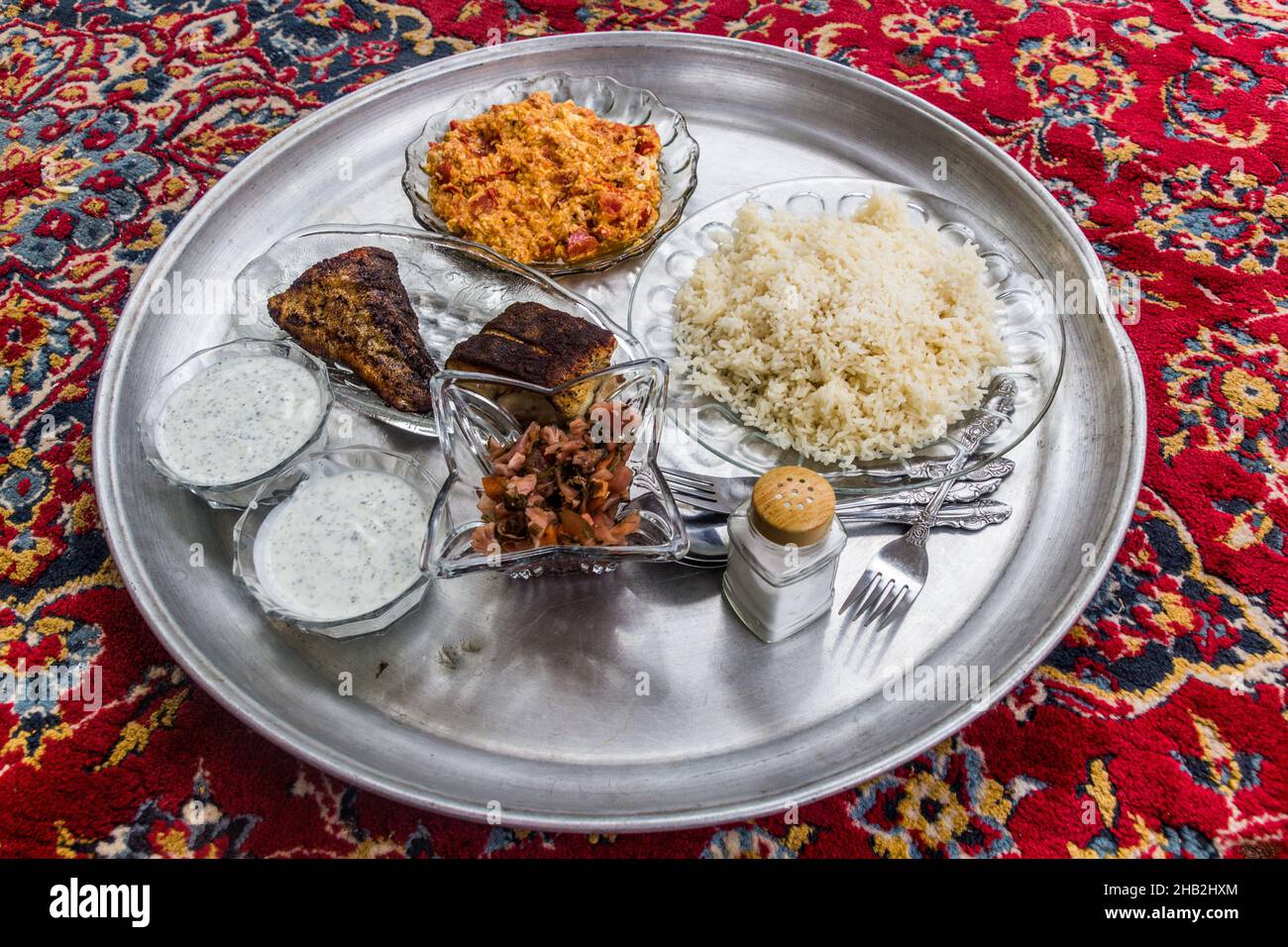 Meal in Iran - Grilled fish with a salad, yogurt, eggs and rice Stock ...