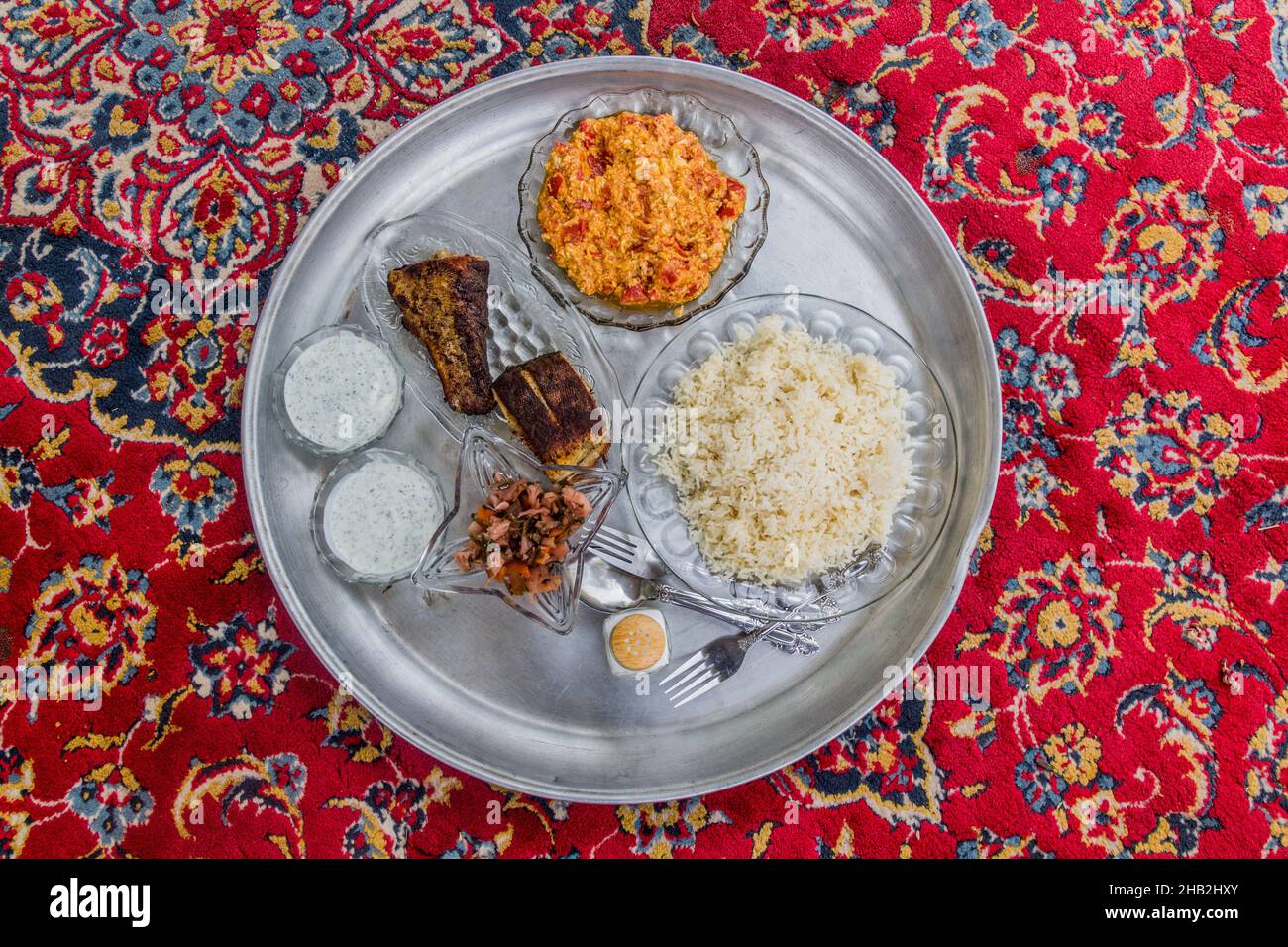 Meal in Iran - Grilled fish with a salad, yogurt, eggs and rice Stock ...