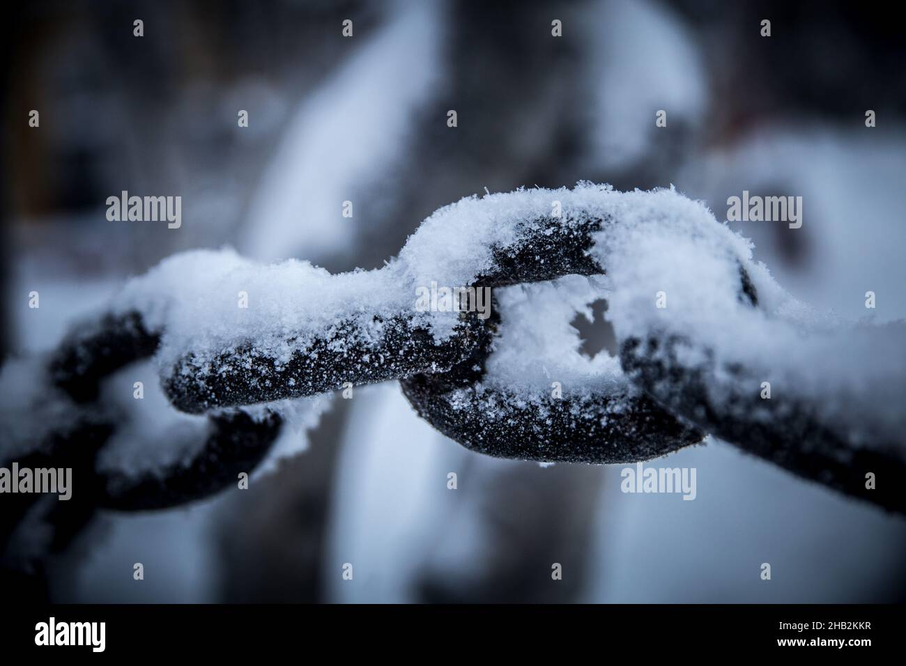 Chain under the snow Stock Photo - Alamy