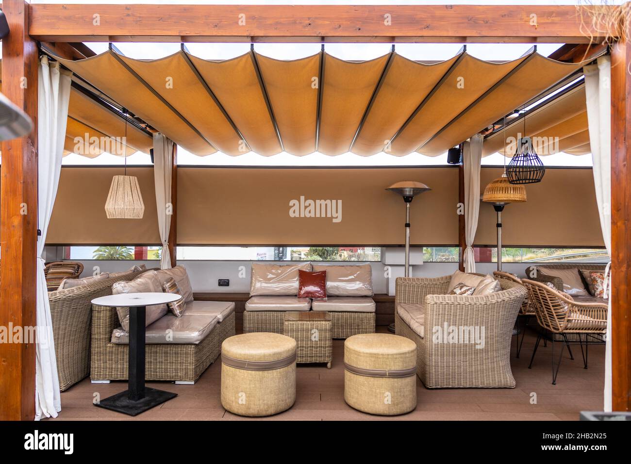 Modern interior of an open-air cafe Stock Photo - Alamy