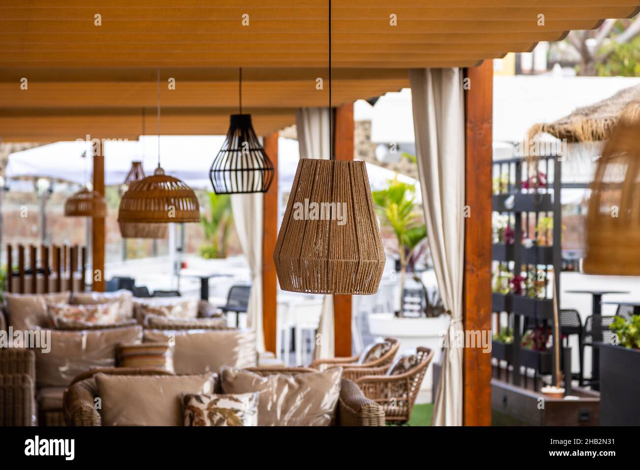Modern interior of an open-air cafe Stock Photo - Alamy