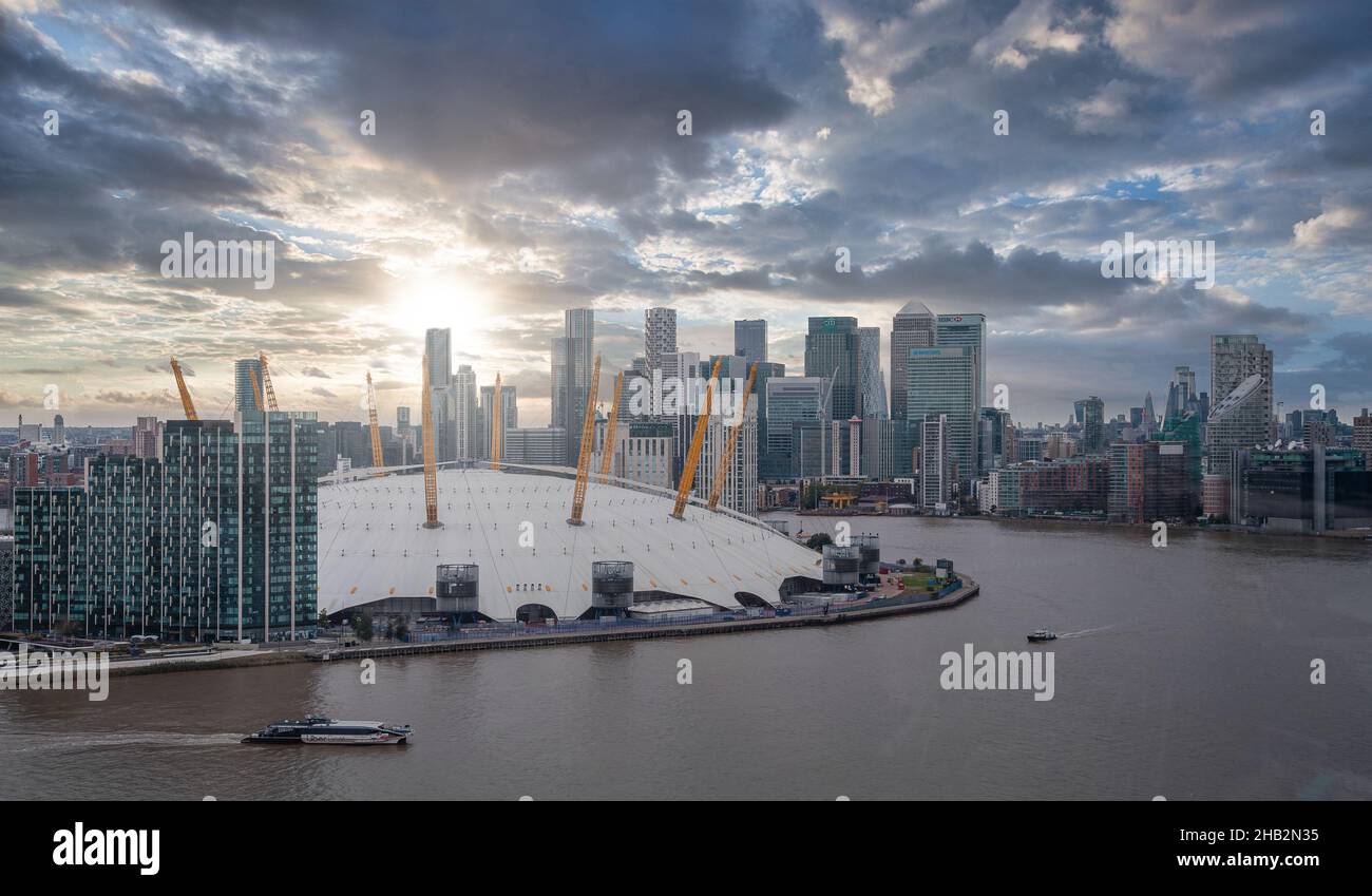 View from the river Thames over Millennium dome or O2 Arena in London ...