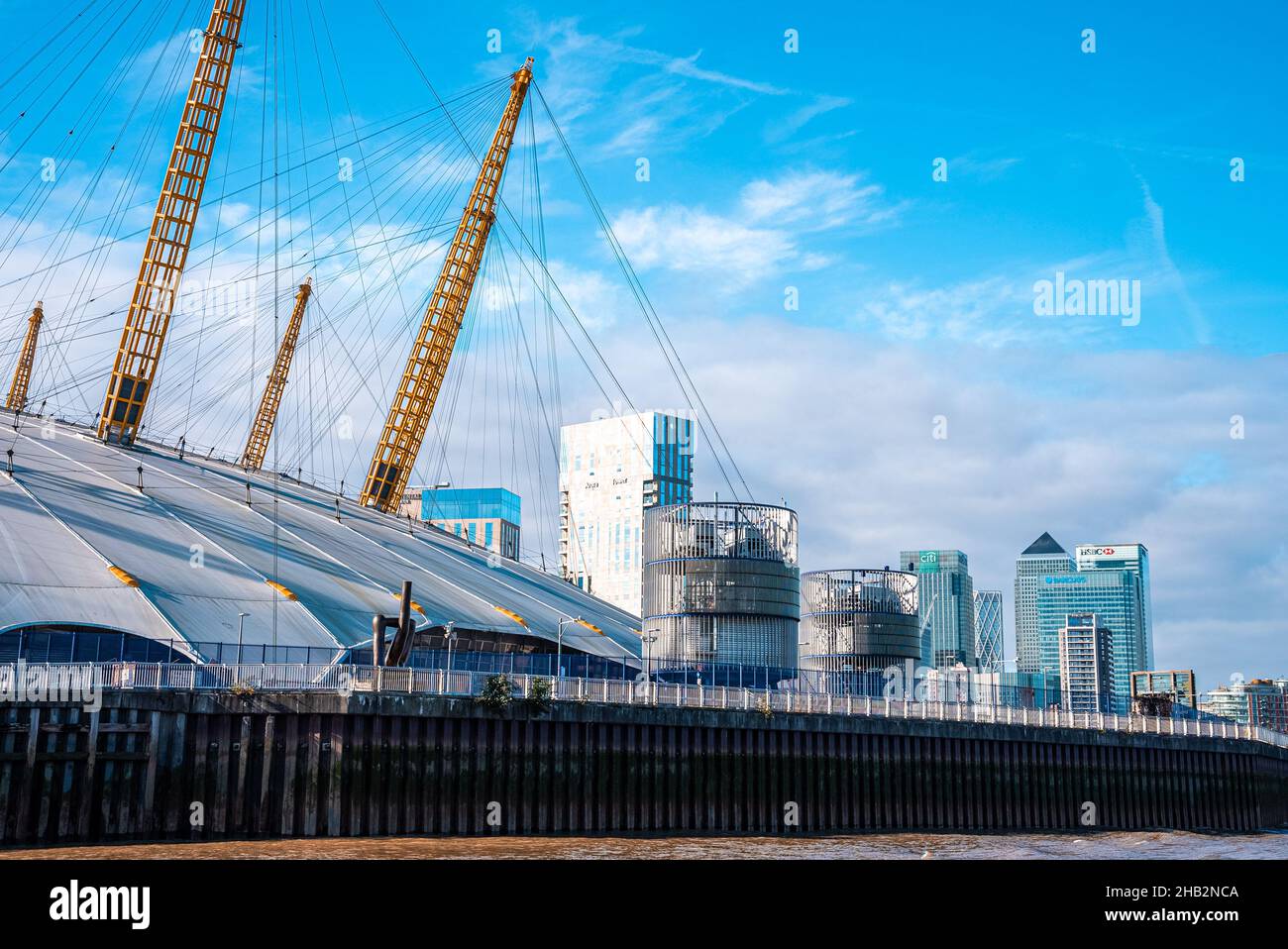 View from the river Thames over Millennium dome or O2 Arena in London ...