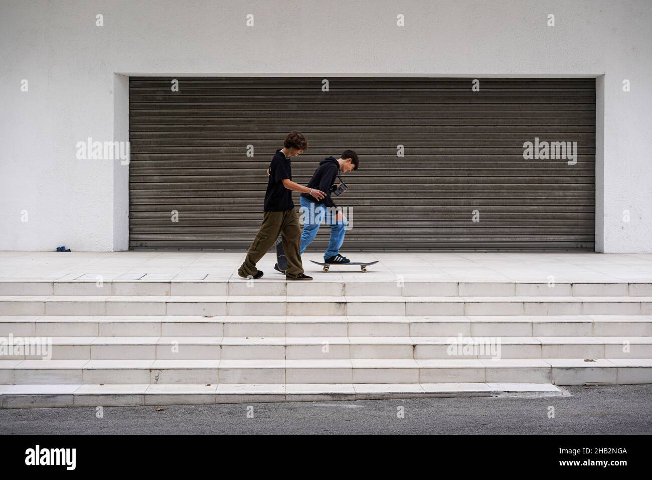 Two boys walking outside hi-res stock photography and images - Alamy