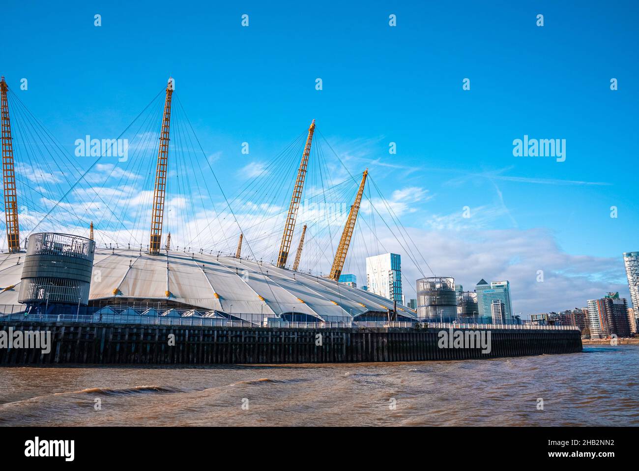 View from the river Thames over Millennium dome or O2 Arena in London ...