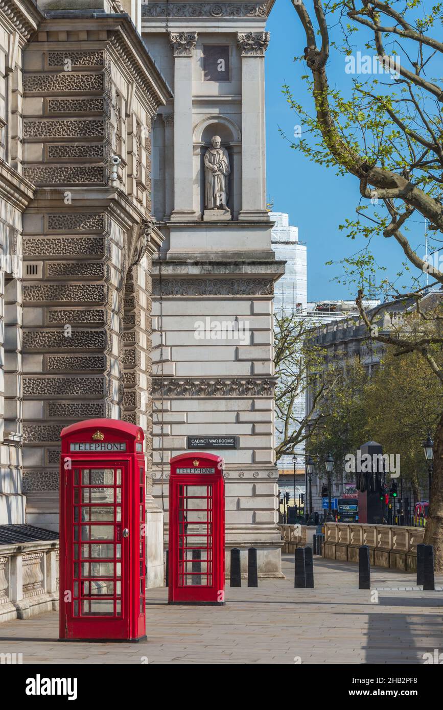 Traditional red telephone kiosks on the streets of London, England, UK ...